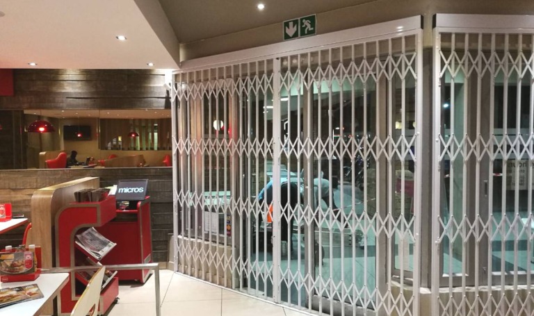 #1 Retractable Security Gates For Sale | DEFENDoor®